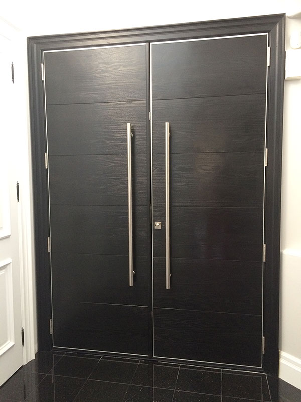 Modern Woodgrain Rustic Doors with Stainless Steel Handles installed in ...